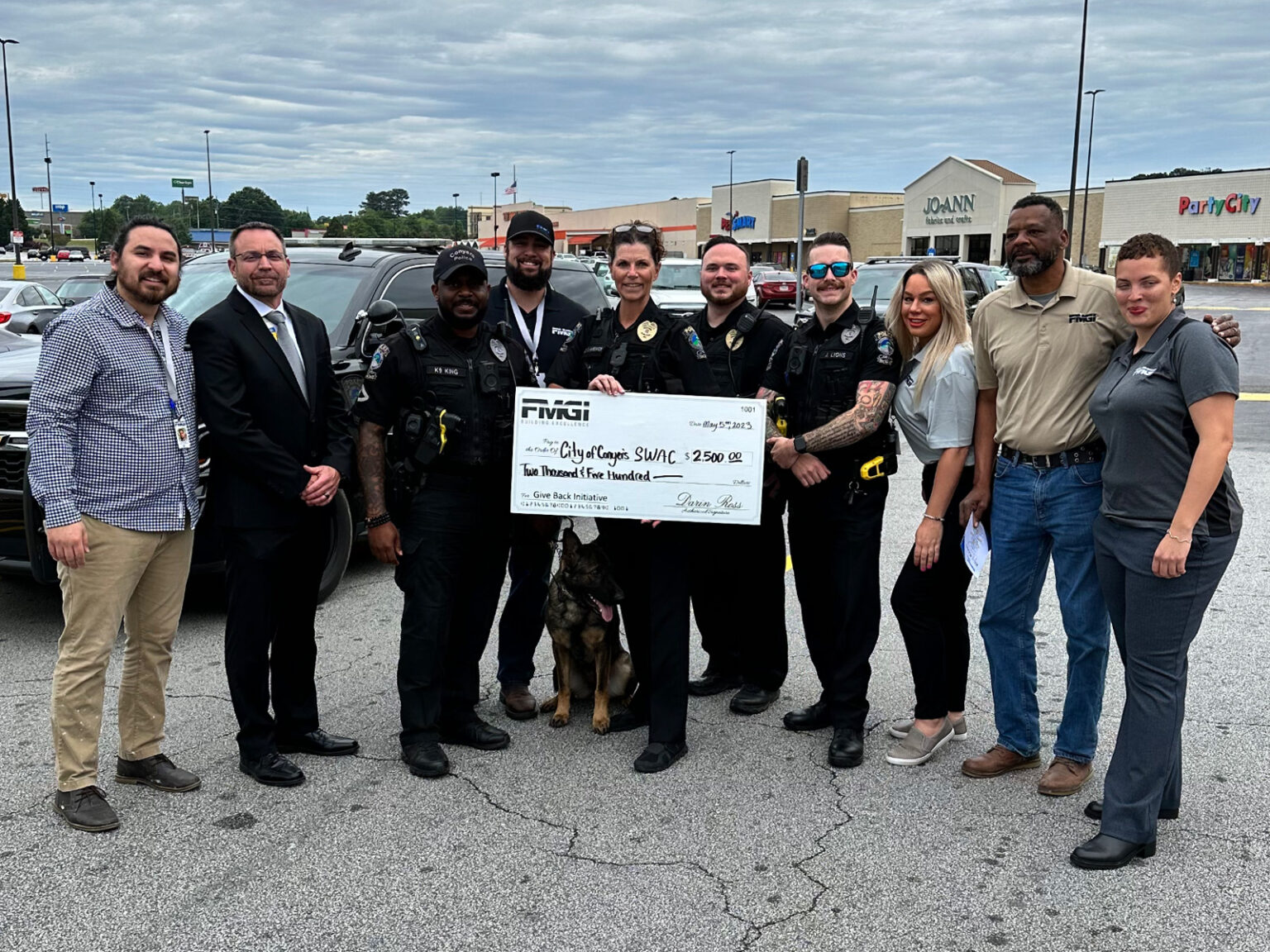 Conyers’ “Shop with a Cop” Program Receives FMGI Give Back Donation - FMGI